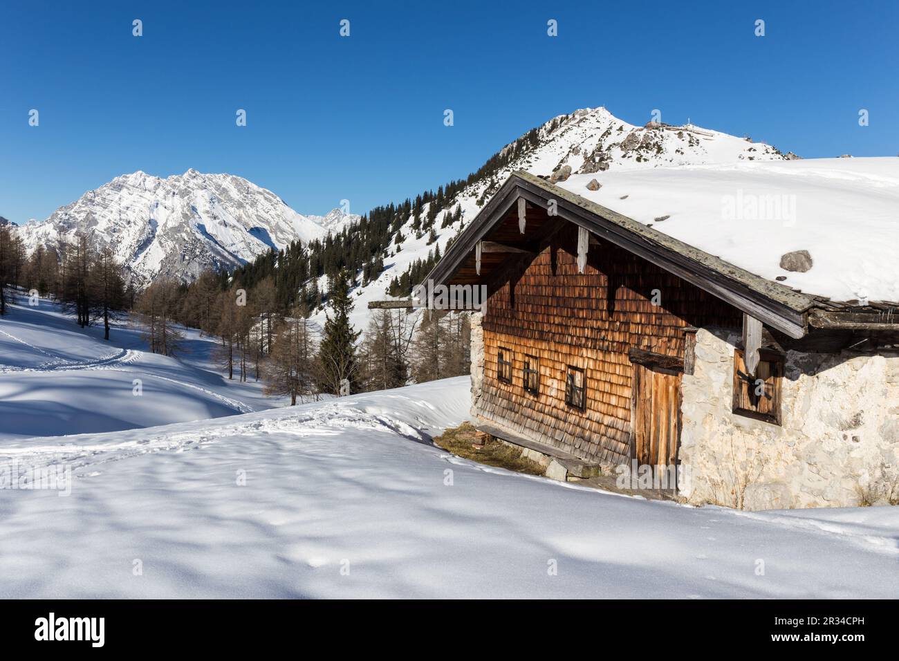 Alp hut in front of Mt. Watzmann in winter Stock Photo - Alamy
