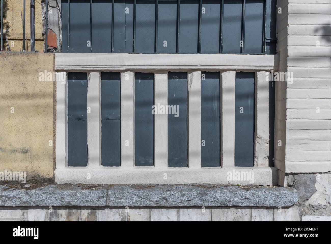 Wall of a building with an amalgamation of materials and designs with ...