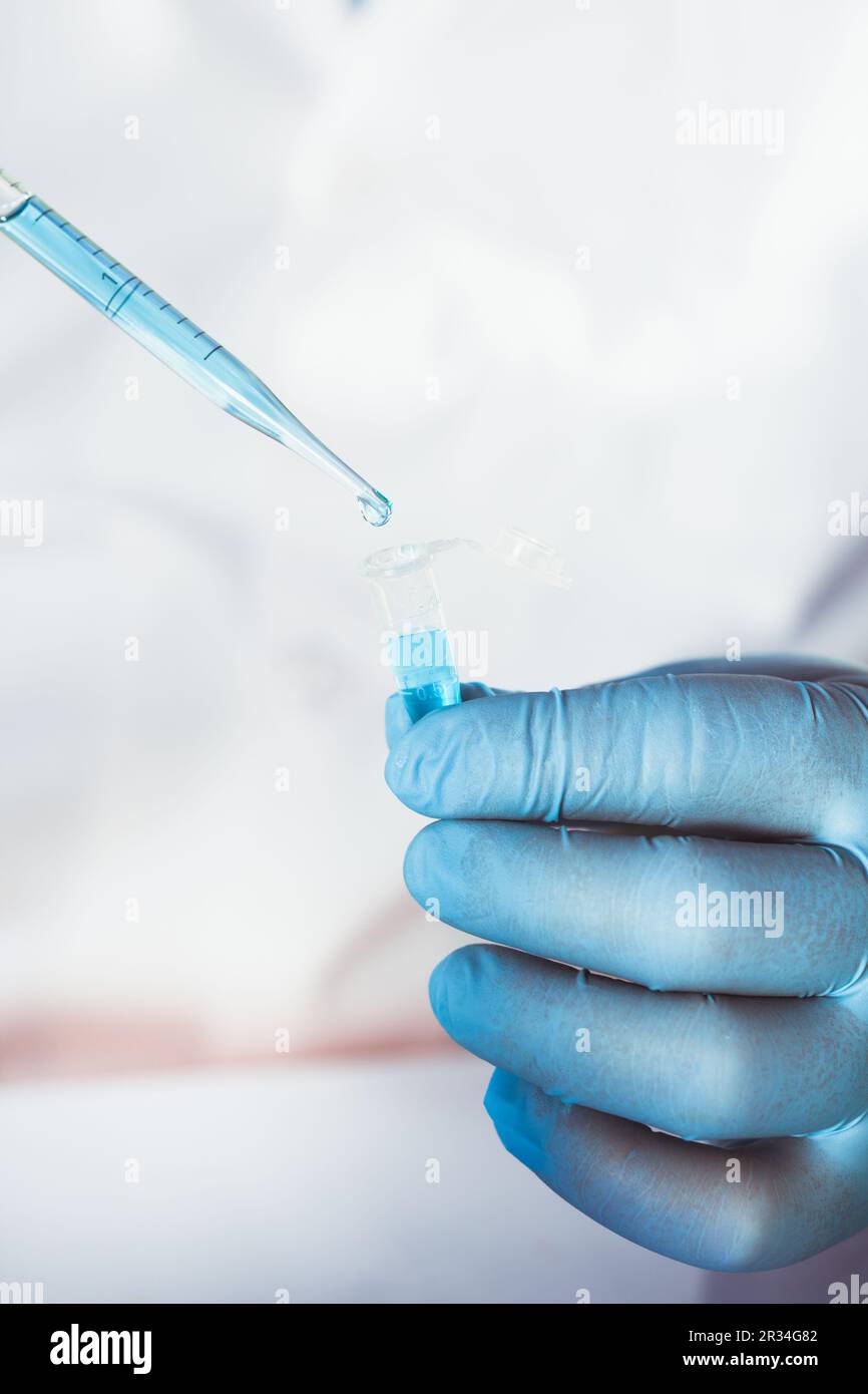 Scientist in lab holding test hi-res stock photography and images - Alamy