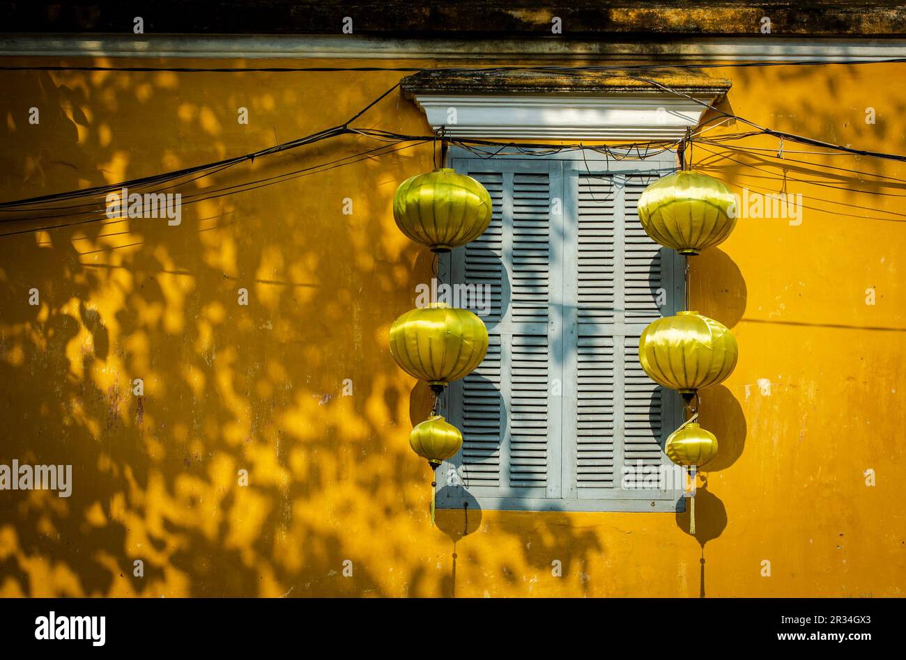 A traditional house in Vietnam Hoi An with yellow wall, light blue ...