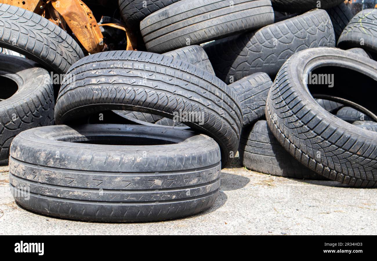Industrial dump for the processing of used tires and rubber tires. Pile ...