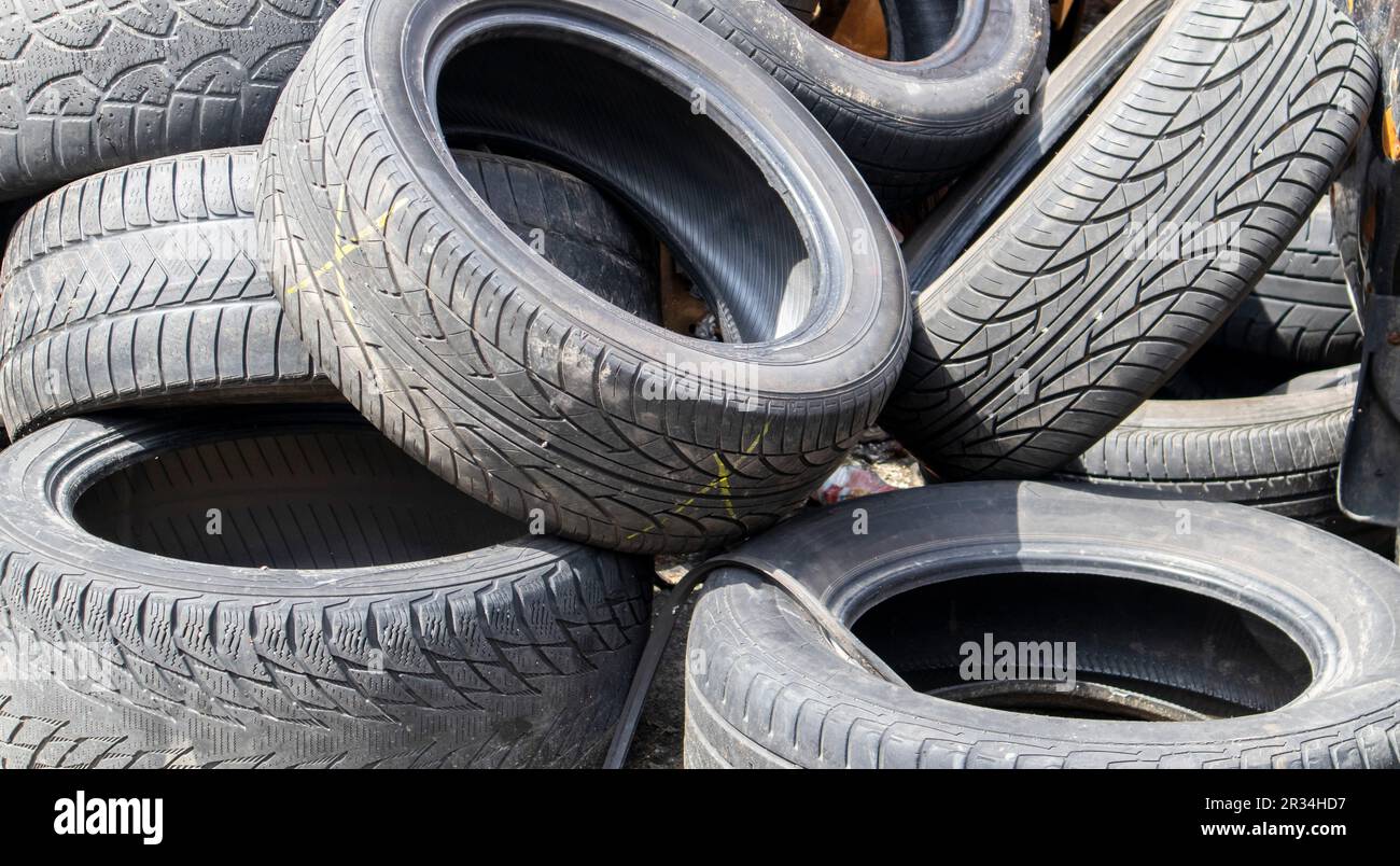 Industrial dump for the processing of used tires and rubber tires. Pile ...
