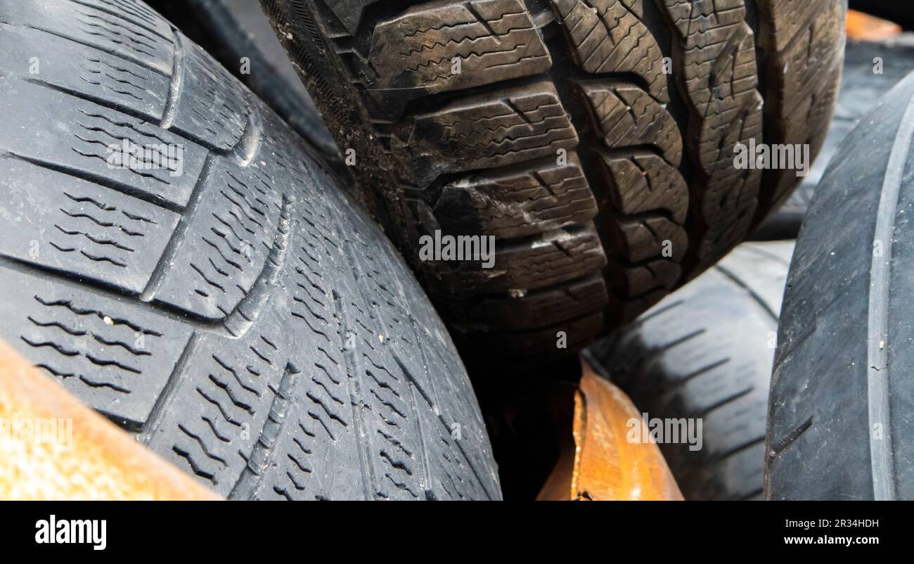 Industrial dump for the processing of used tires and rubber tires. Pile ...