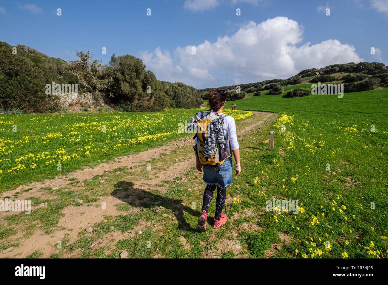 hiker walking the horse path, - Cami de Cavalls-,s'Albufera des Grau ...