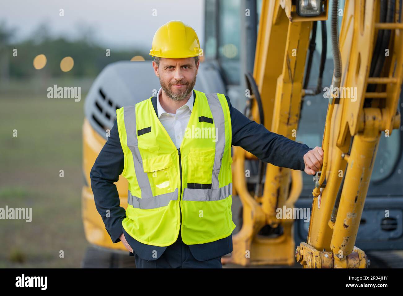 Civil engineer worker at a construction site. Engineer man in front of ...