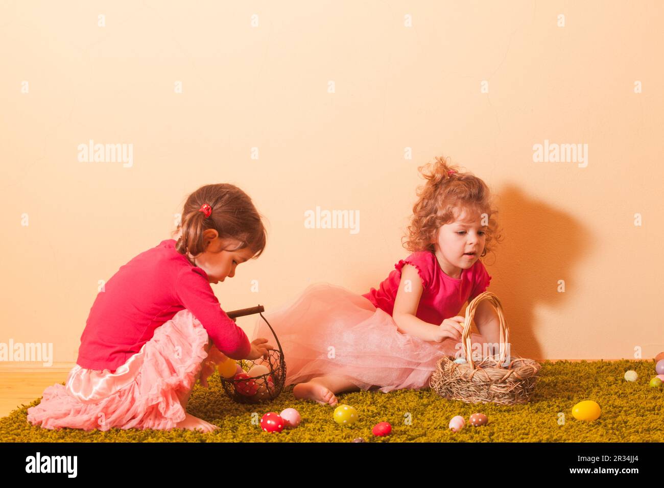 Girls on an Easter Egg hunt Stock Photo - Alamy