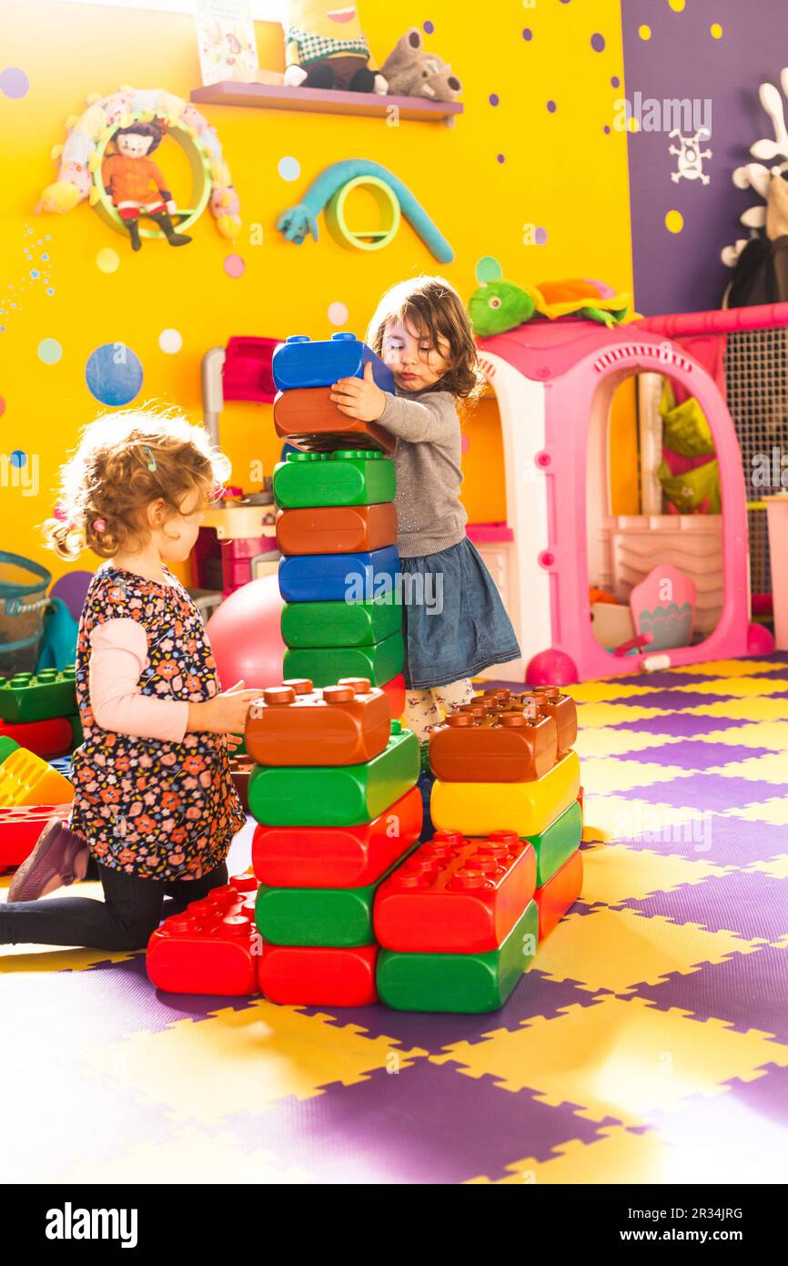 Two girls play Stock Photo - Alamy