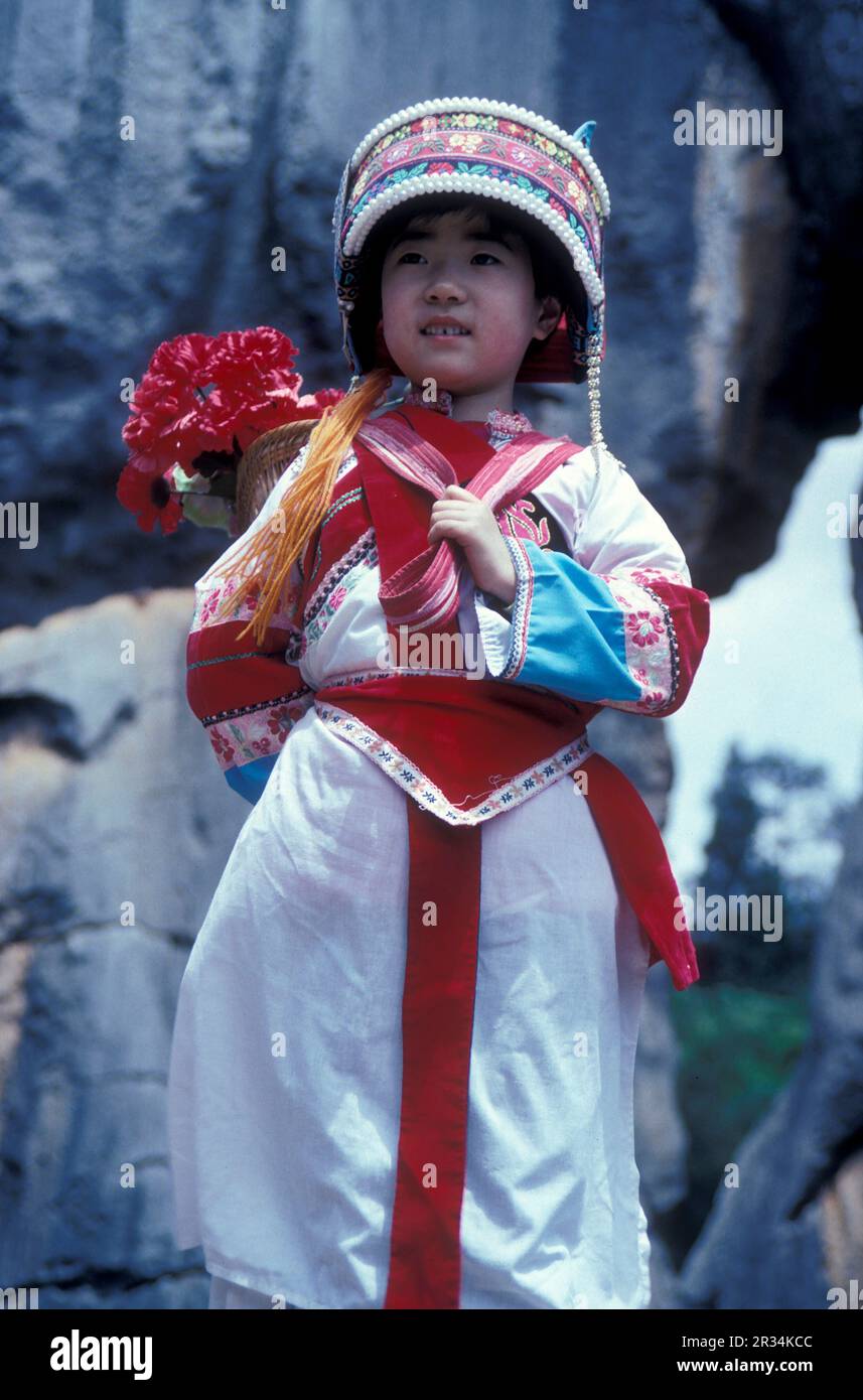 people in traditional costume of chinese minorities posing at the ...