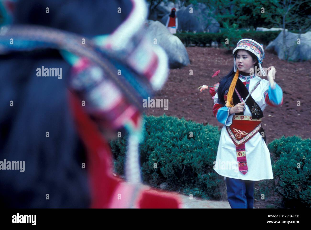 people in traditional costume of chinese minorities posing at the ...