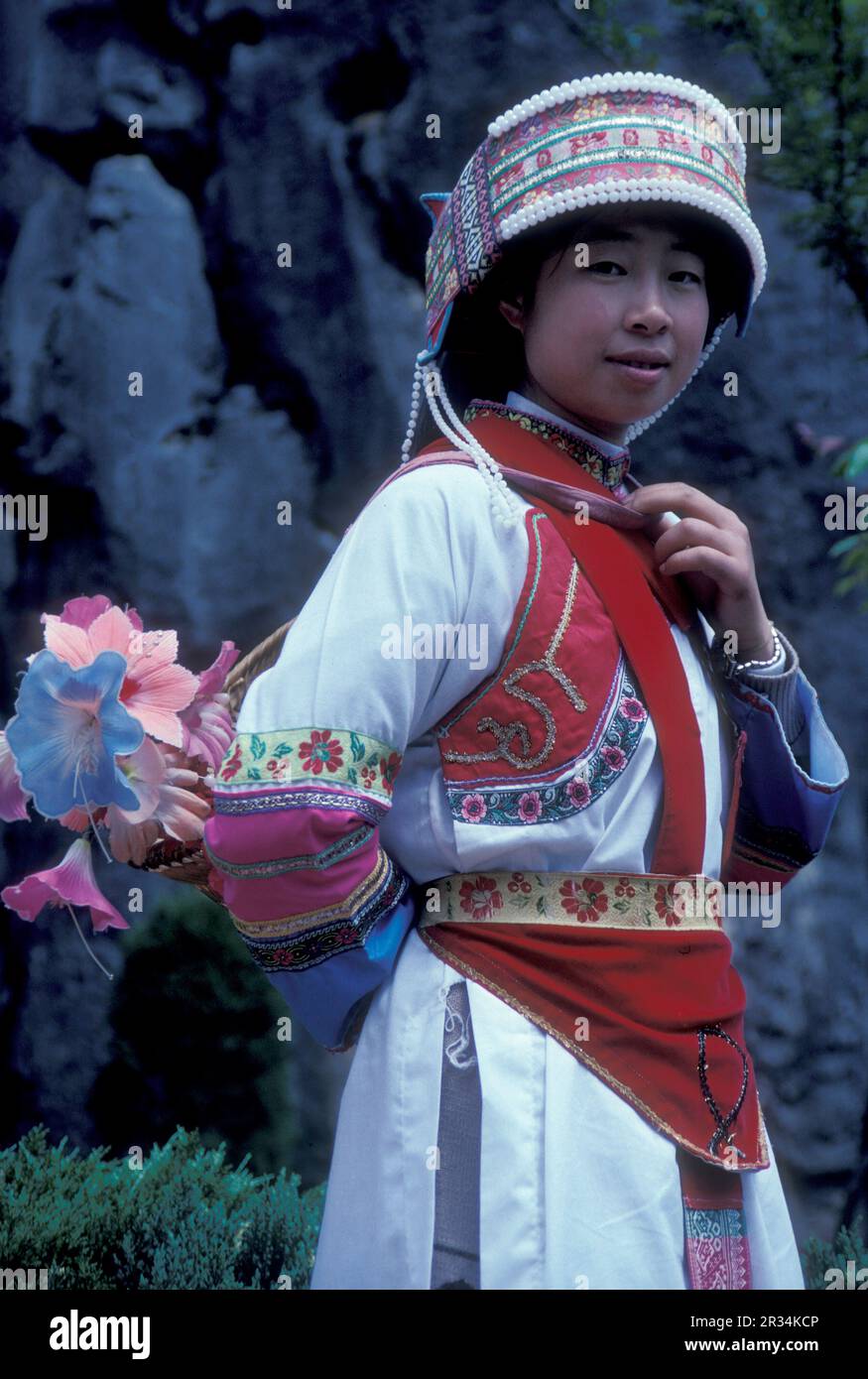 people in traditional costume of chinese minorities posing at the ...