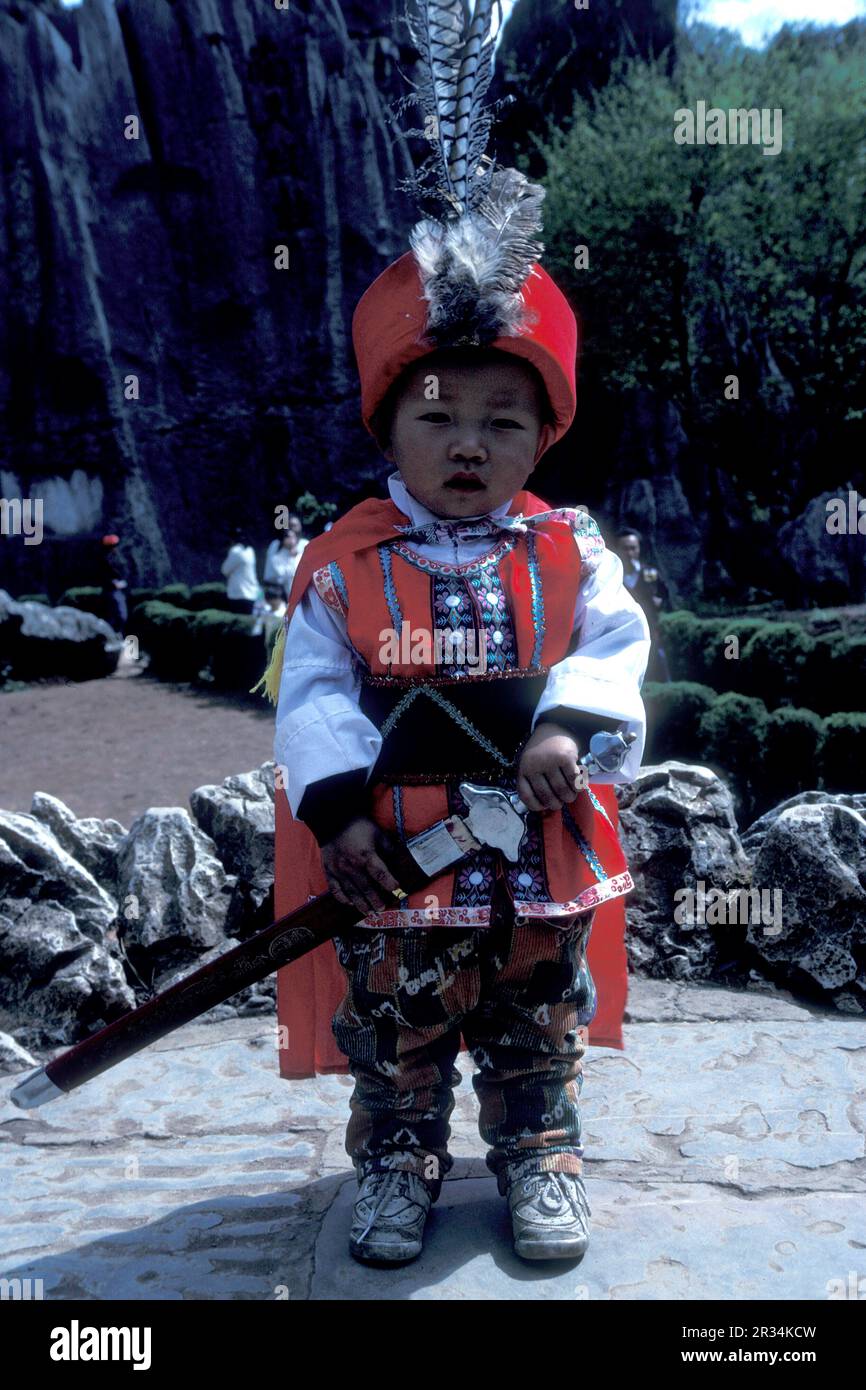 people in traditional costume of chinese minorities posing at the ...