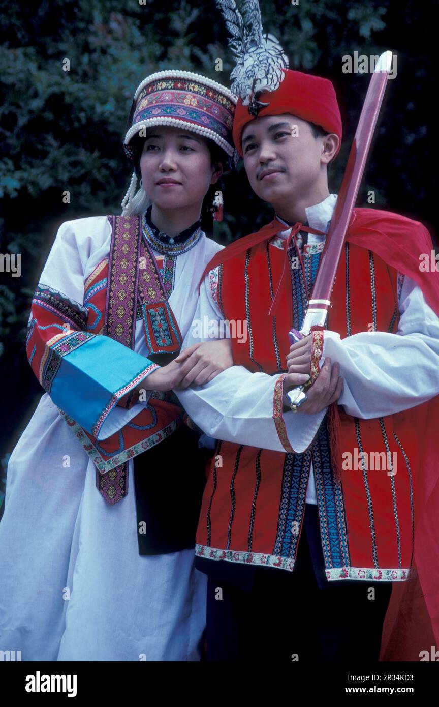people in traditional costume of chinese minorities posing at the ...