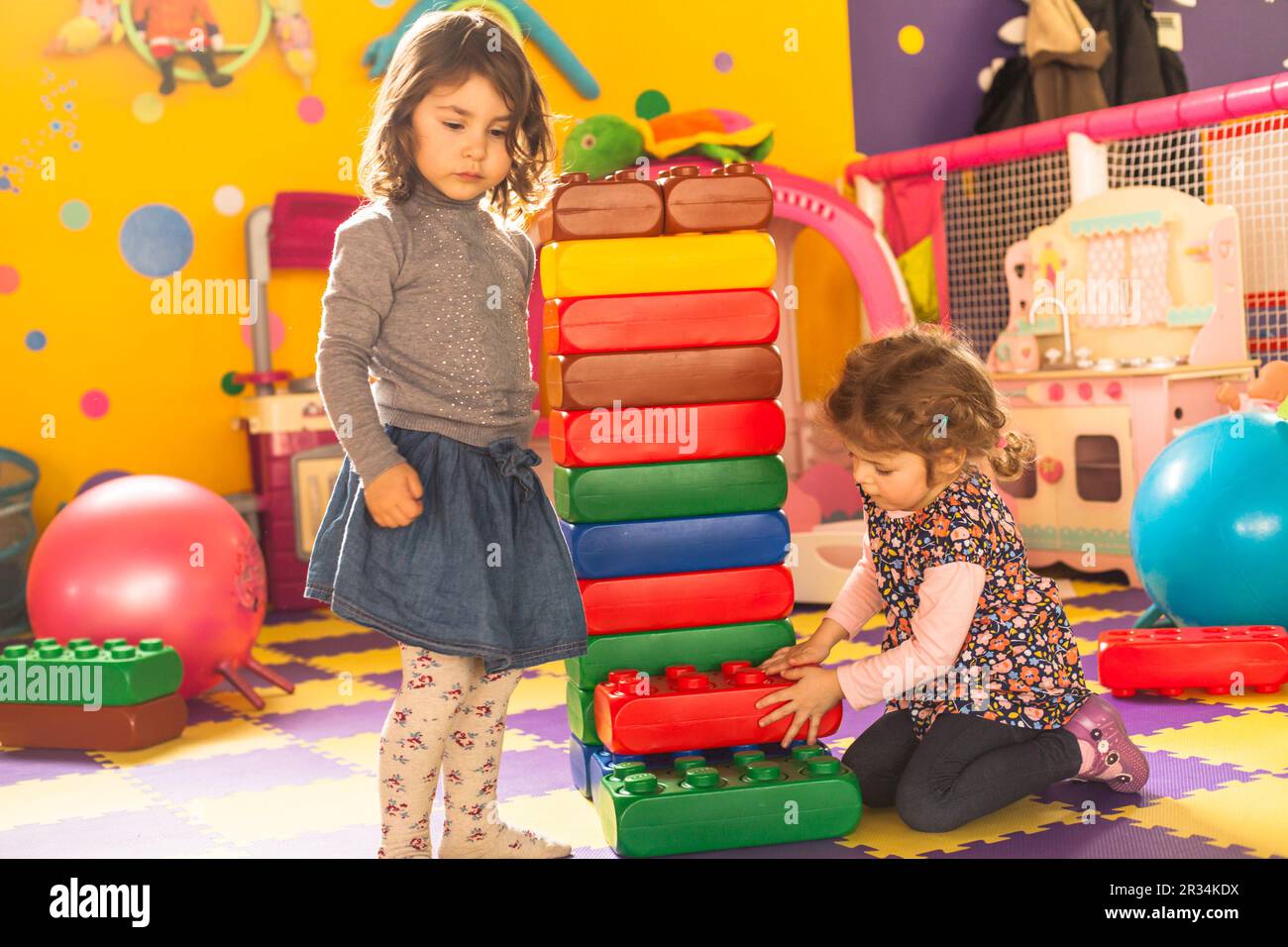 Two girls play Stock Photo - Alamy