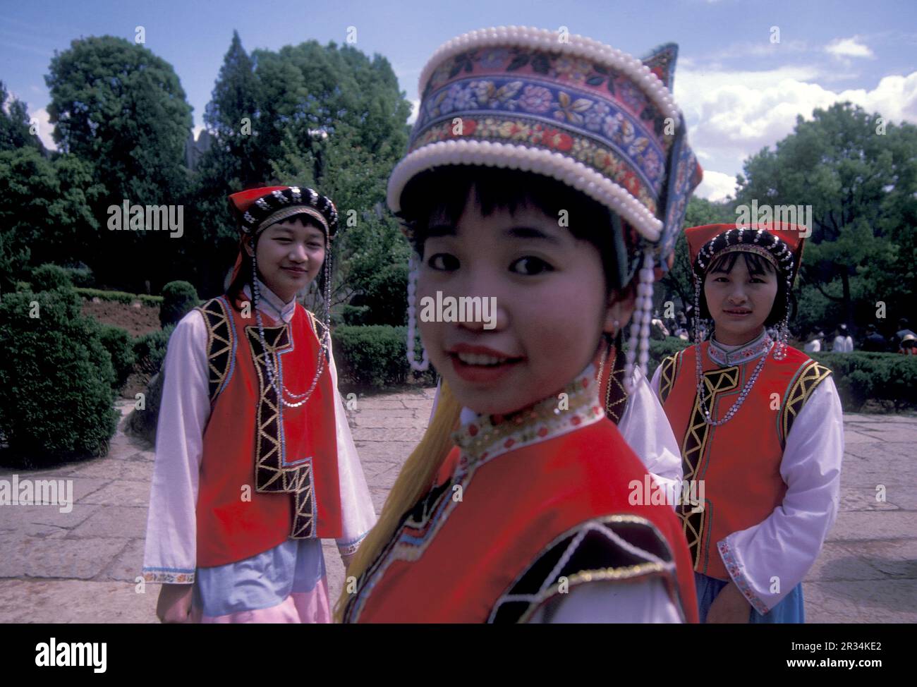 people in traditional costume of chinese minorities posing at the ...