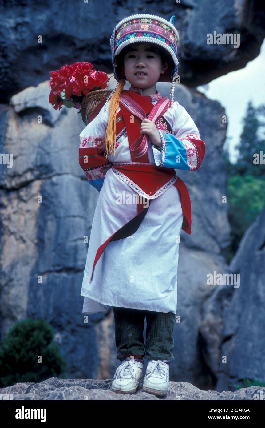 people in traditional costume of chinese minorities posing at the ...