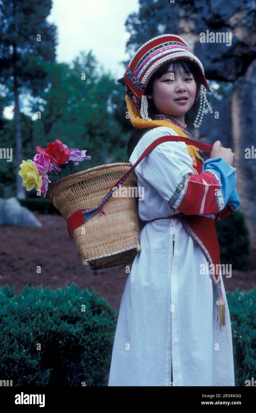 people in traditional costume of chinese minorities posing at the ...
