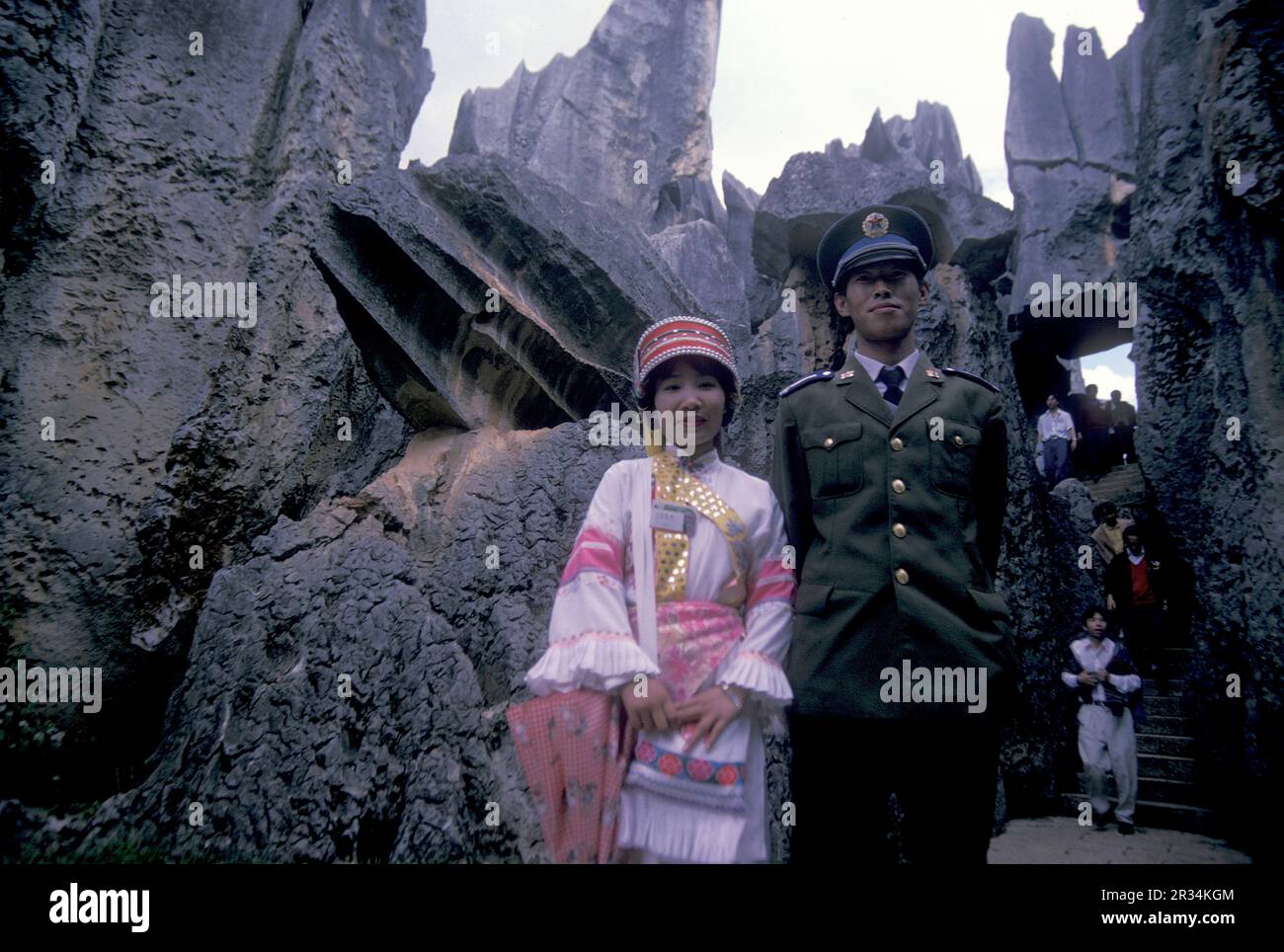 people in traditional costume of chinese minorities posing at the ...