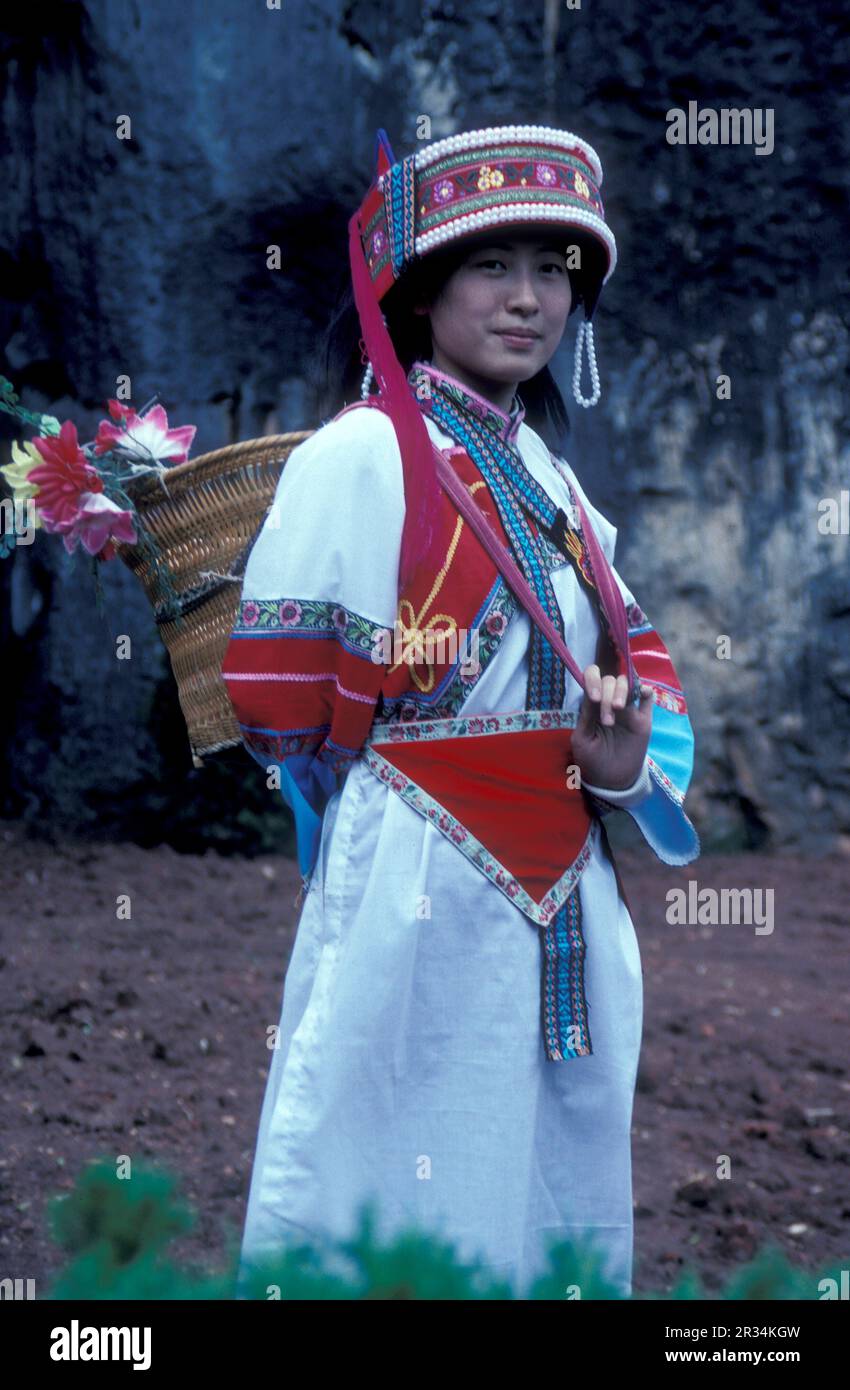 people in traditional costume of chinese minorities posing at the ...