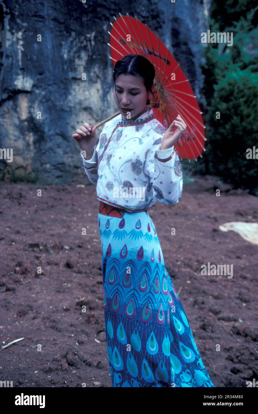 people in traditional costume of chinese minorities posing at the ...