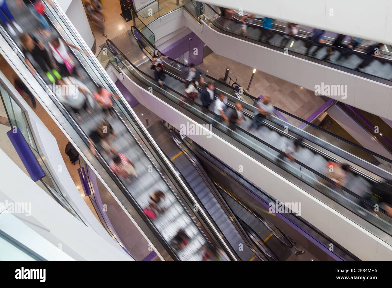 Escalators in a department store Stock Photo - Alamy