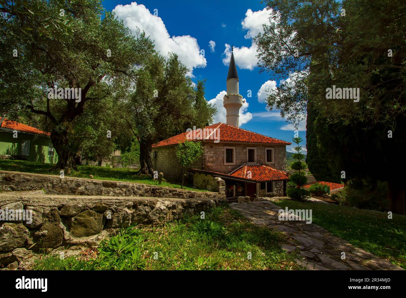 View of Ömer Pasha Mosque and Sheikh Hasan Lodge among olive trees in ...
