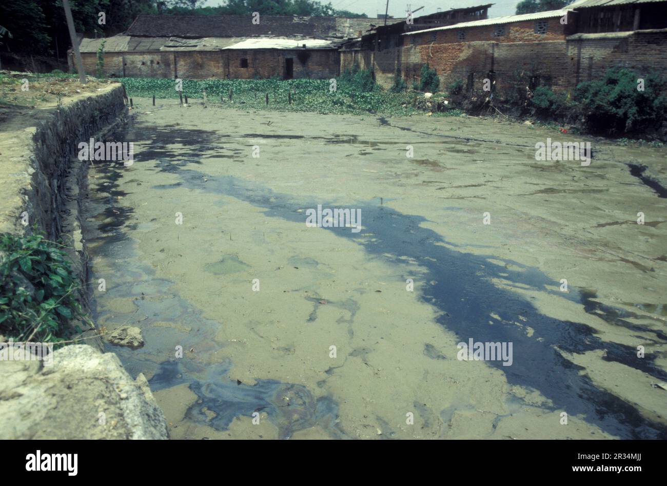 a durty river in the city centre of Menglunshen in Xishuangbanna in the ...