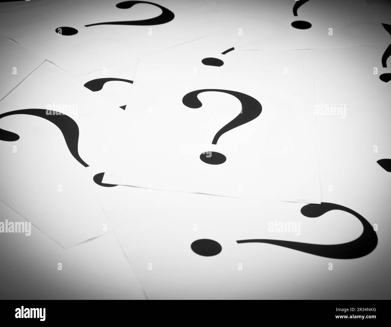 Close up too many question marks background Stock Photo - Alamy
