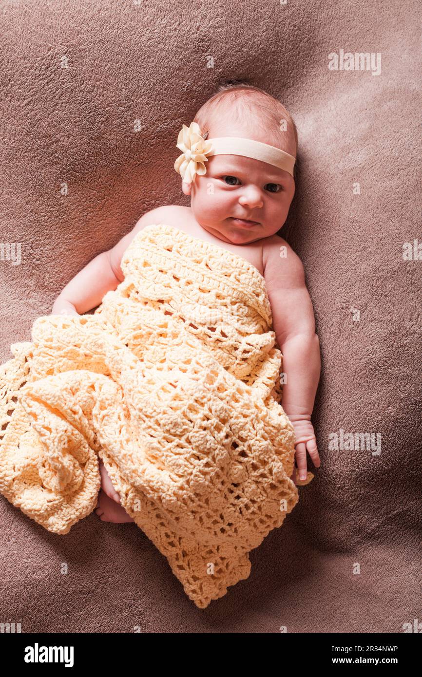 Baby girl covering face with hat hi-res stock photography and images ...