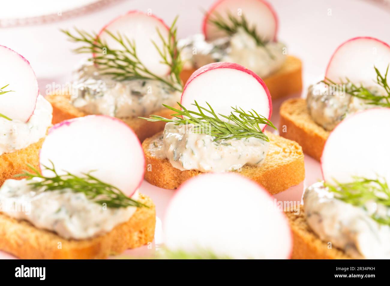 Canapes with radish Stock Photo - Alamy
