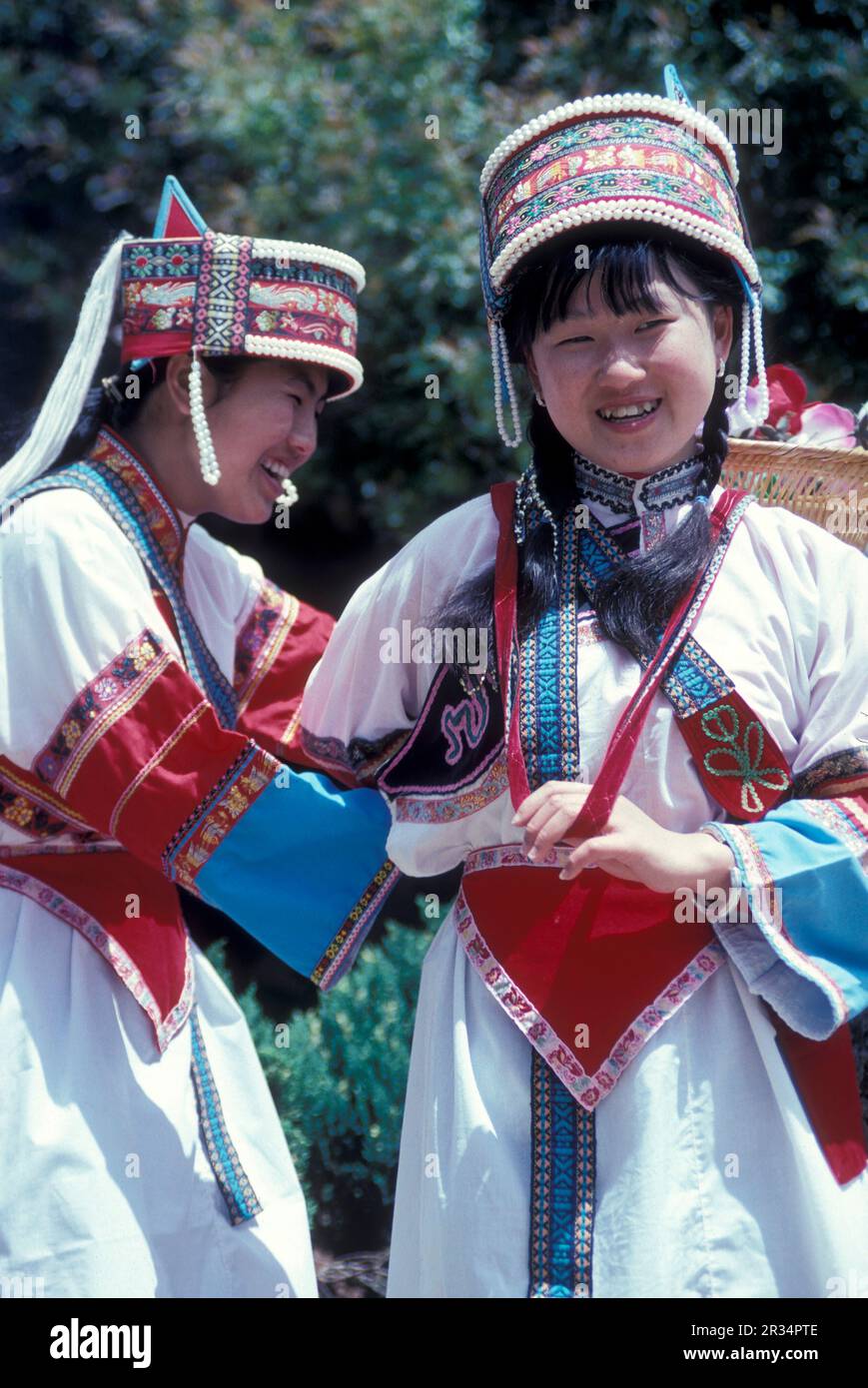 people in traditional costume of chinese minorities posing at the ...