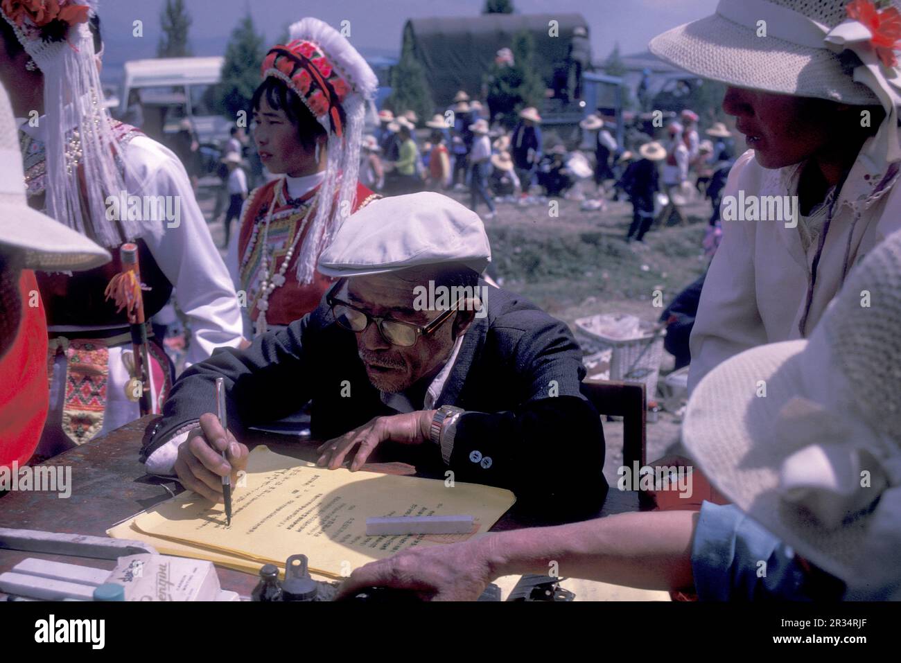 a fortune teller with chinese Minority People in traditional costum at ...