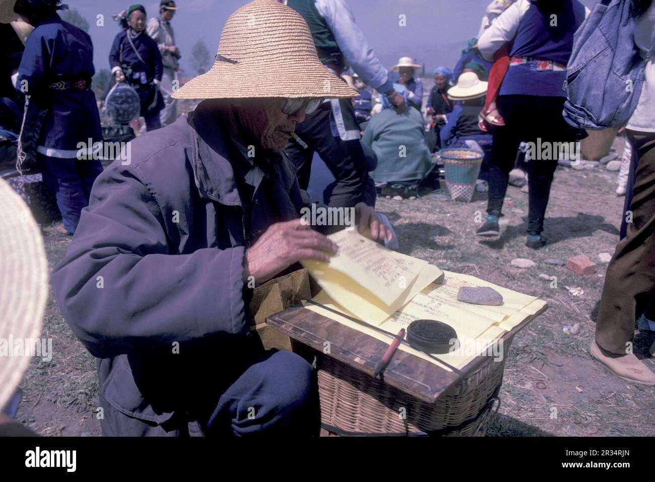 a fortune teller with chinese Minority People in traditional costum at ...