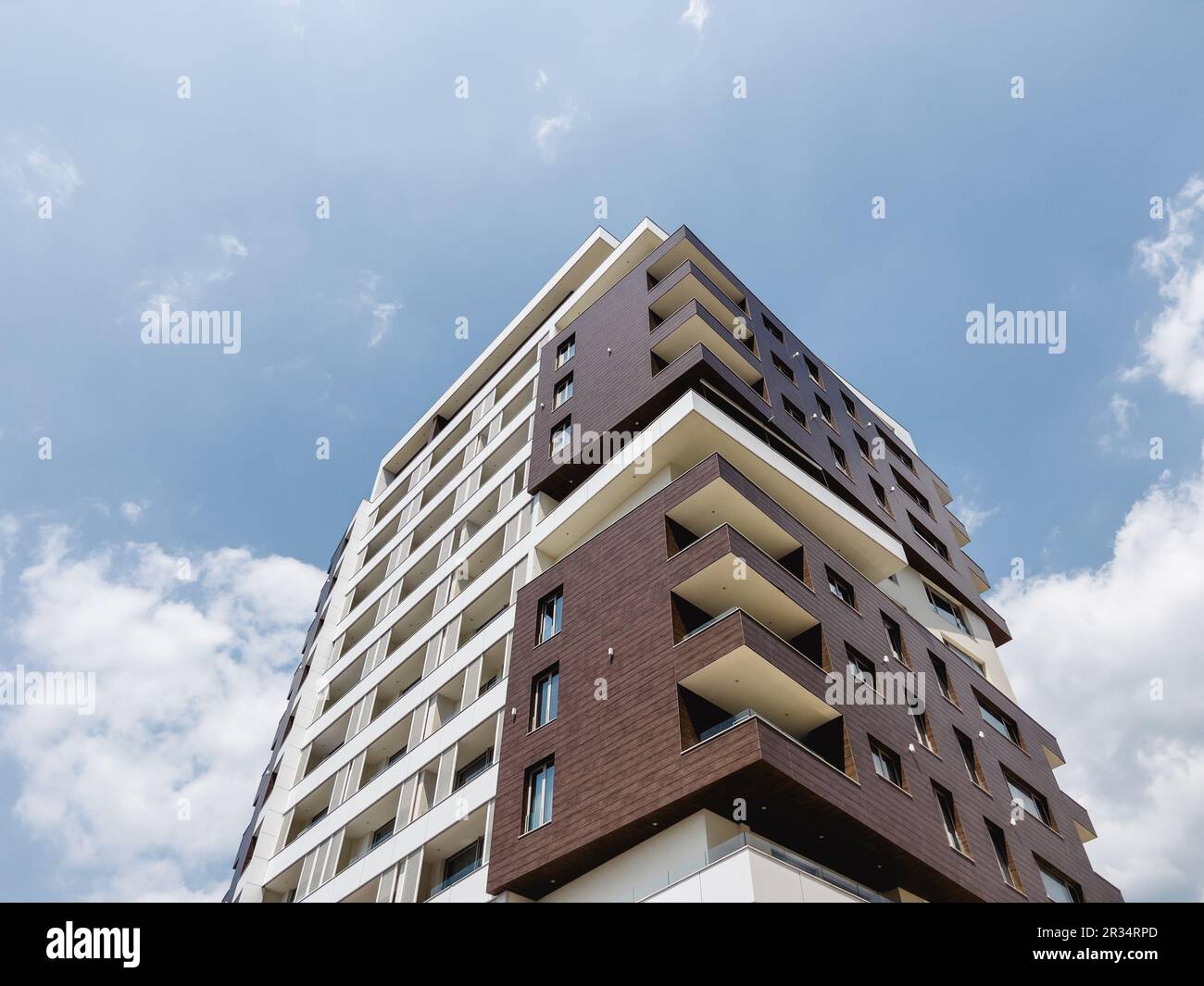 Modern high-rise hotel building with rectangular terraces against the ...