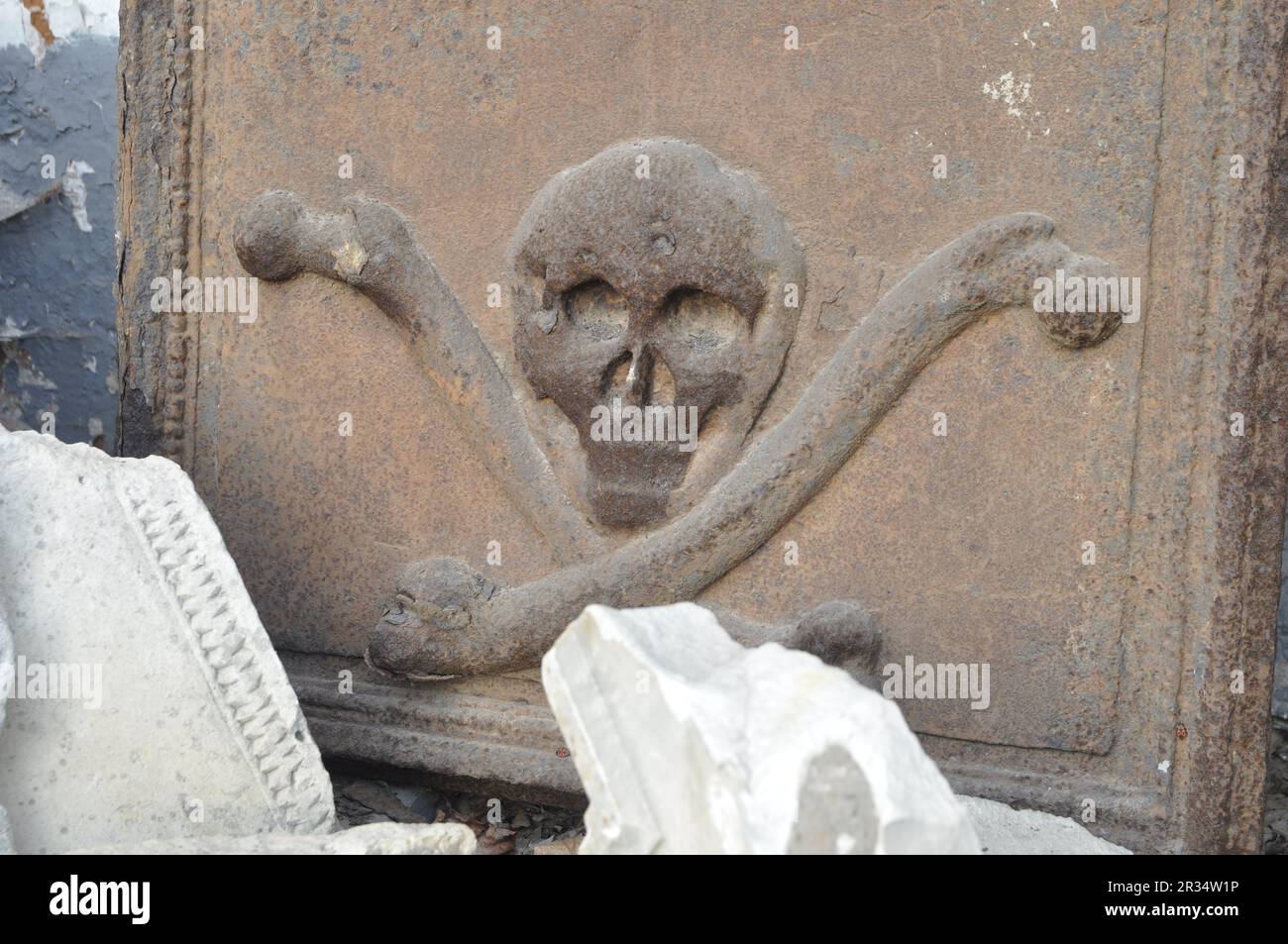 Memento mori, depicting a skull and bones on a cast-iron tombstone ...