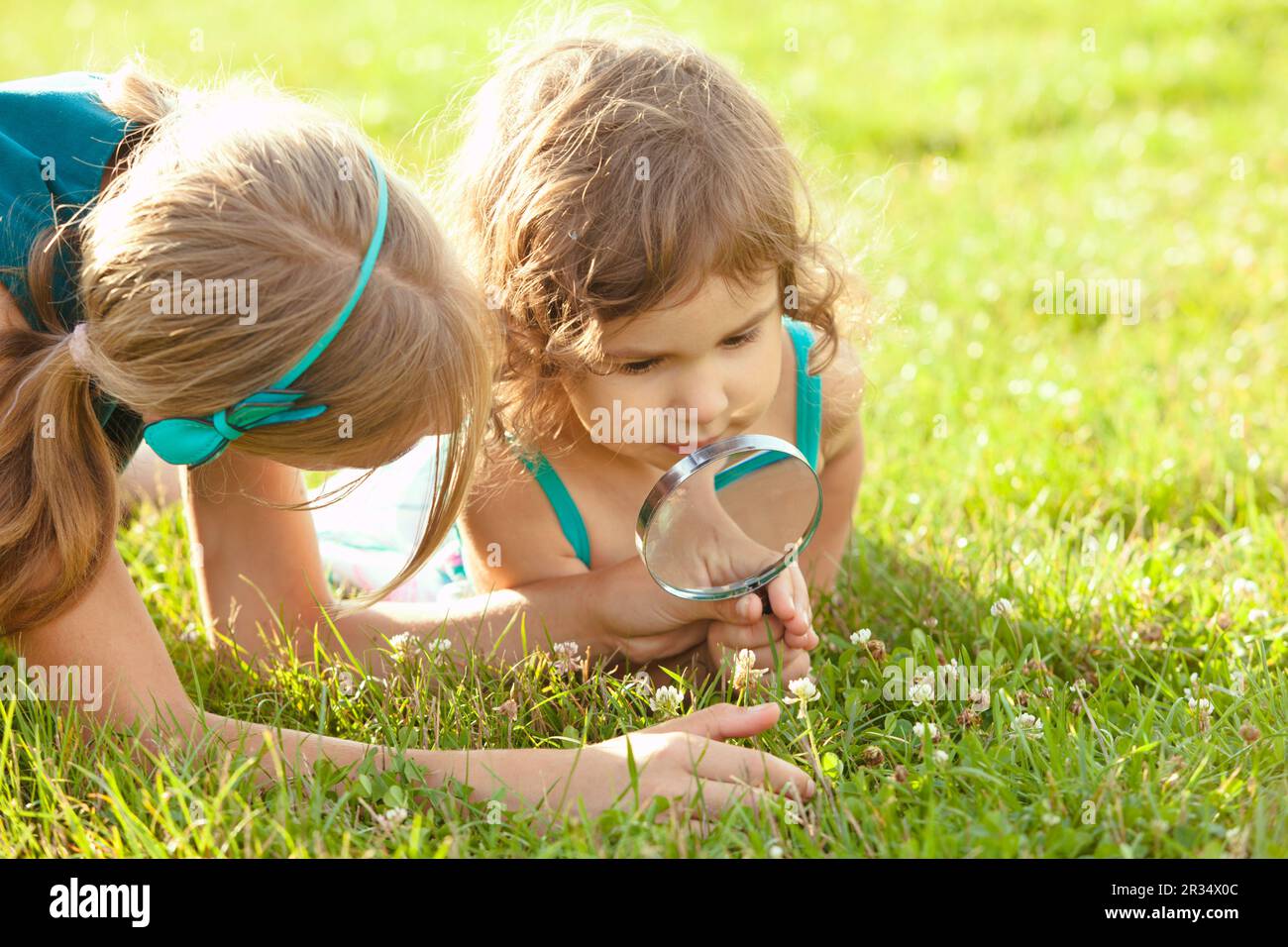 Kid with magnifying glass Stock Photo - Alamy