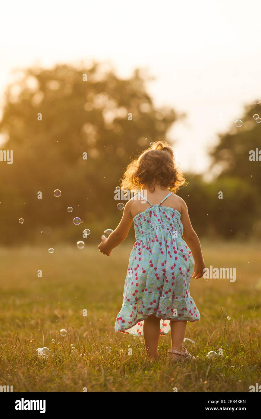 Little girl running behind little hi-res stock photography and images ...