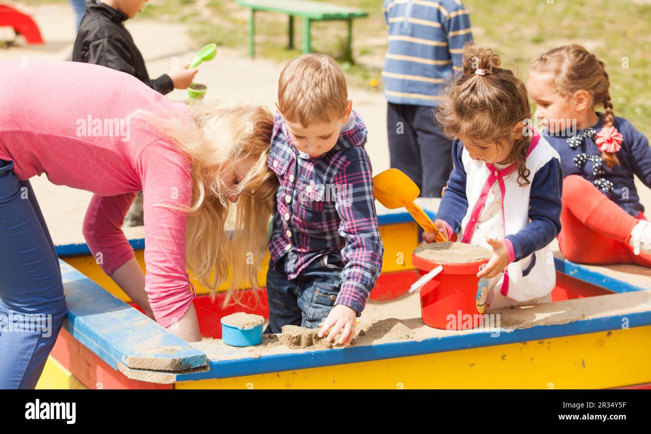 Playing in the sandbox Stock Photo - Alamy
