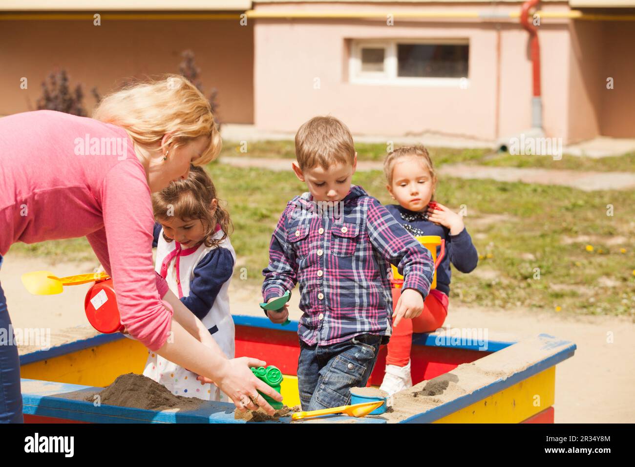 Playing in the sandbox Stock Photo - Alamy