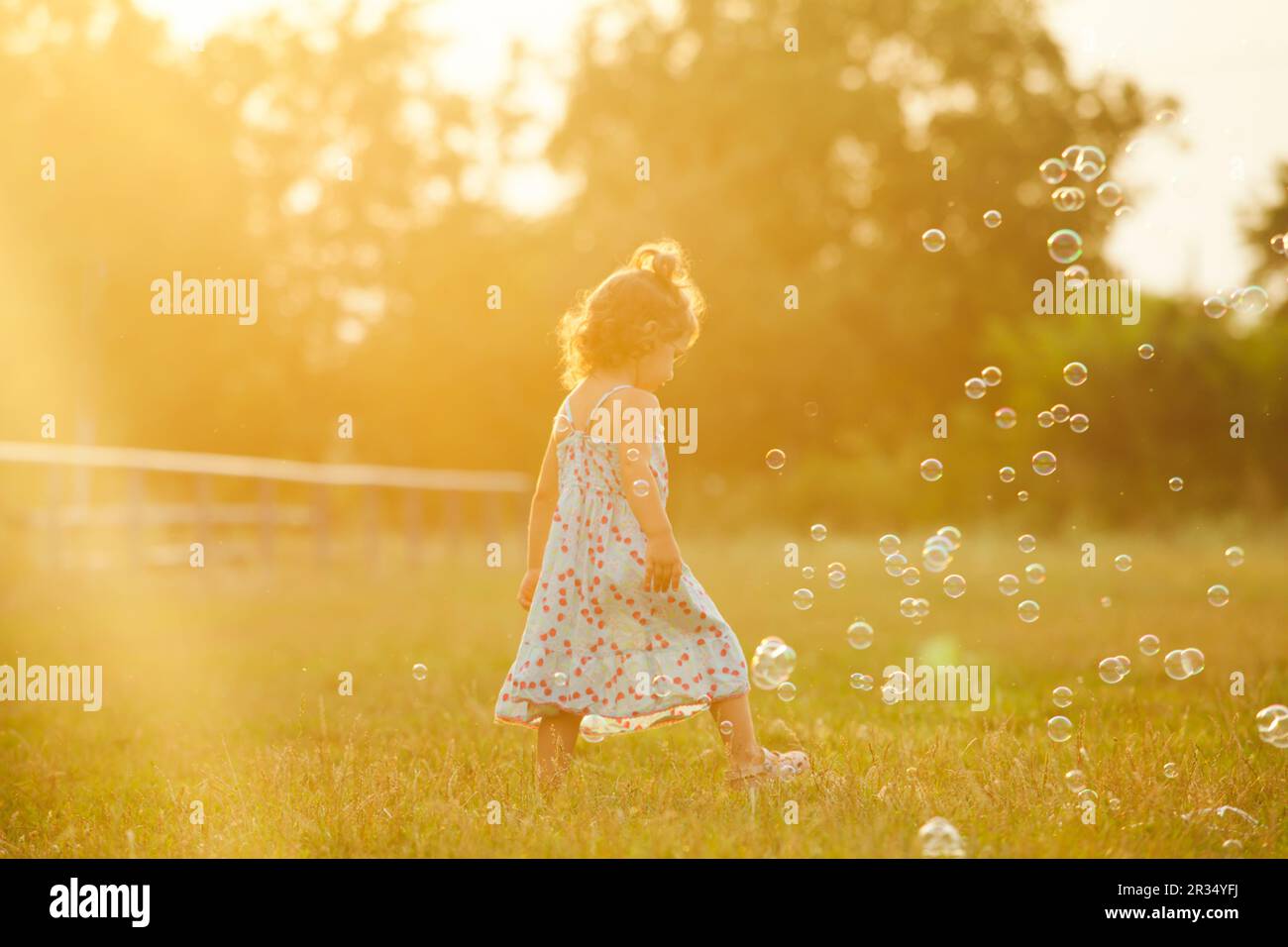 Little girl running behind little hi-res stock photography and images ...
