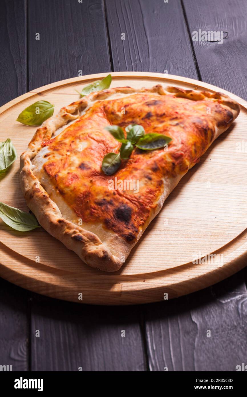 Calzone stuffed pizza tomato hi-res stock photography and images - Alamy