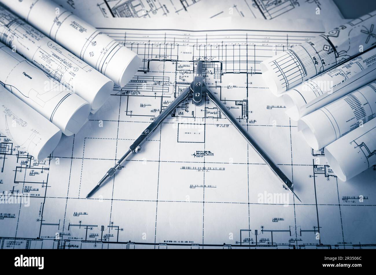 Rolls of architecture blueprints and house plans Stock Photo - Alamy