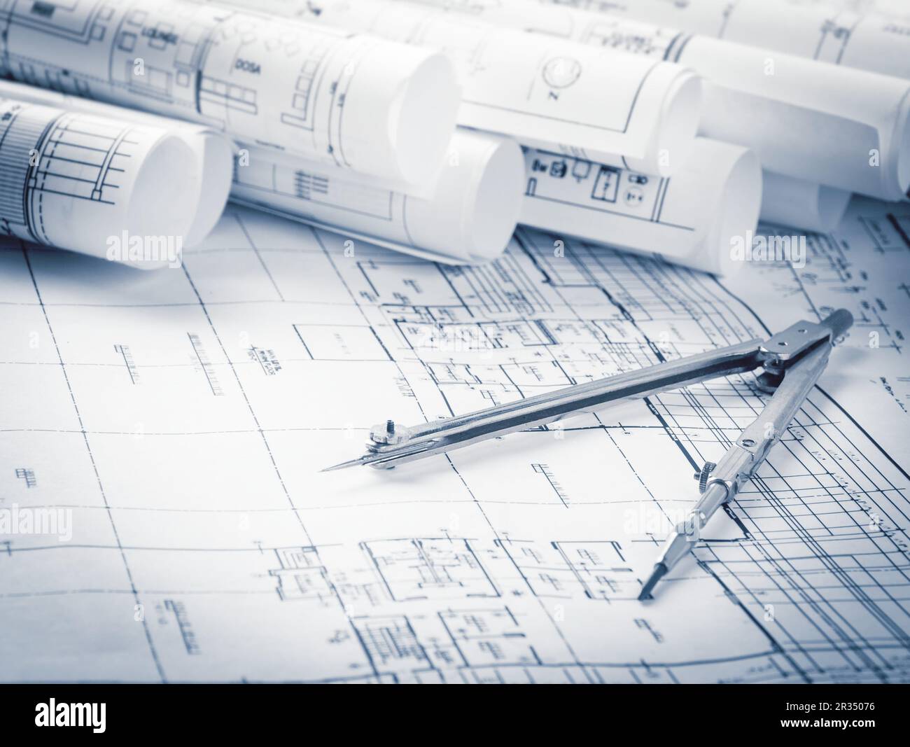Rolls of architecture blueprints and house plans Stock Photo - Alamy
