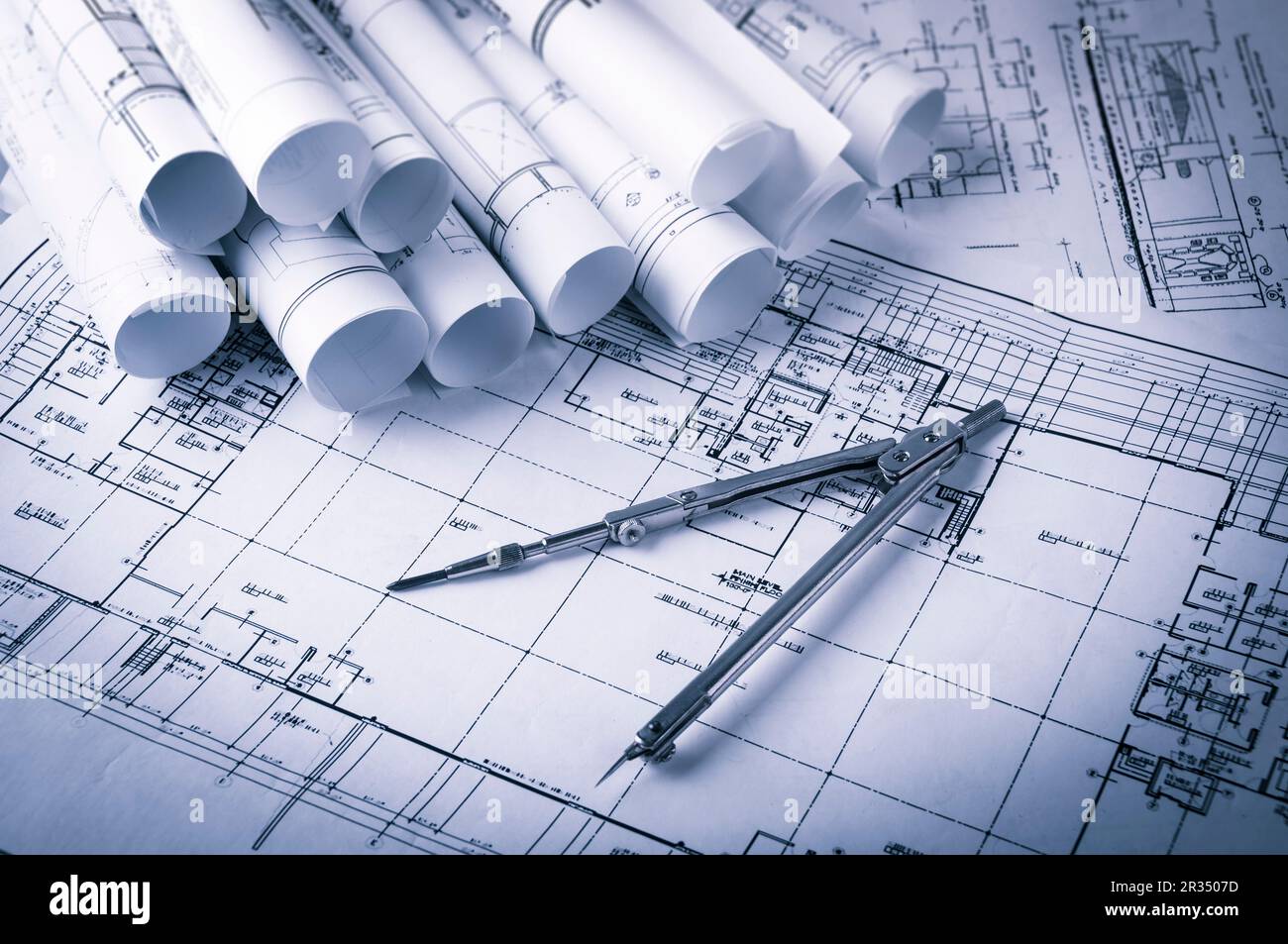 Rolls of architecture blueprints and house plans Stock Photo - Alamy