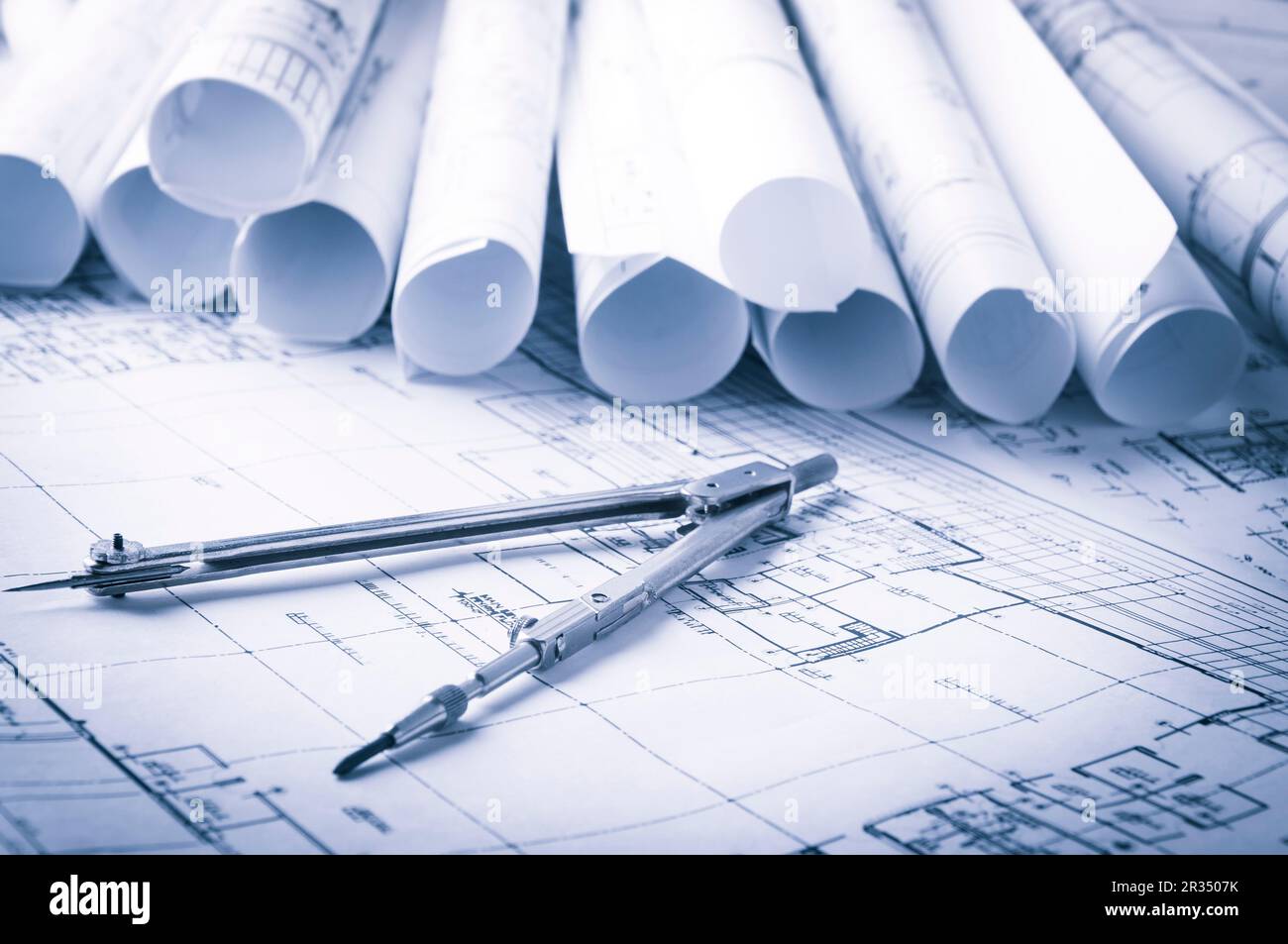 Rolls of architecture blueprints and house plans Stock Photo - Alamy