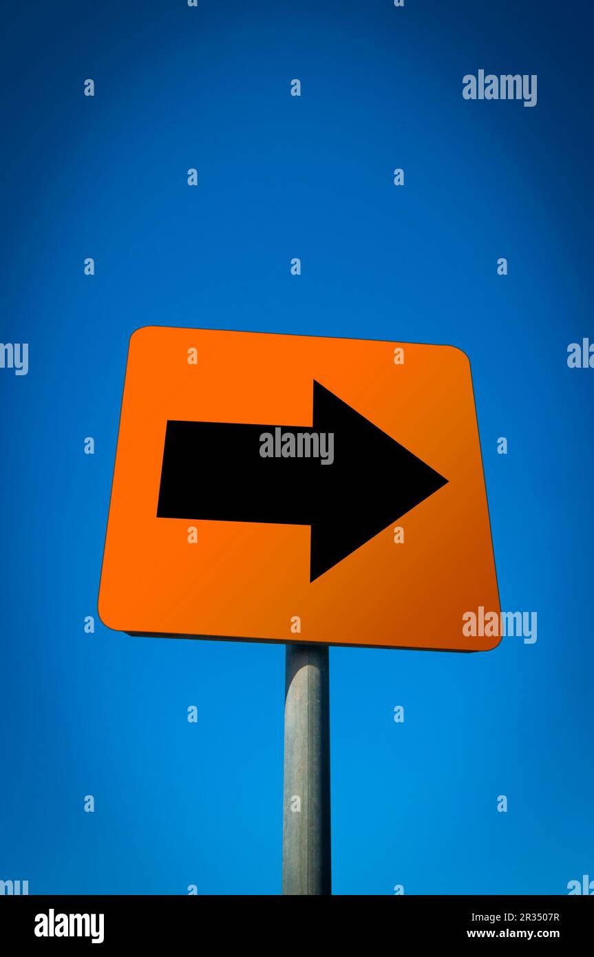 A black arrow red sign pointing to the right Stock Photo - Alamy