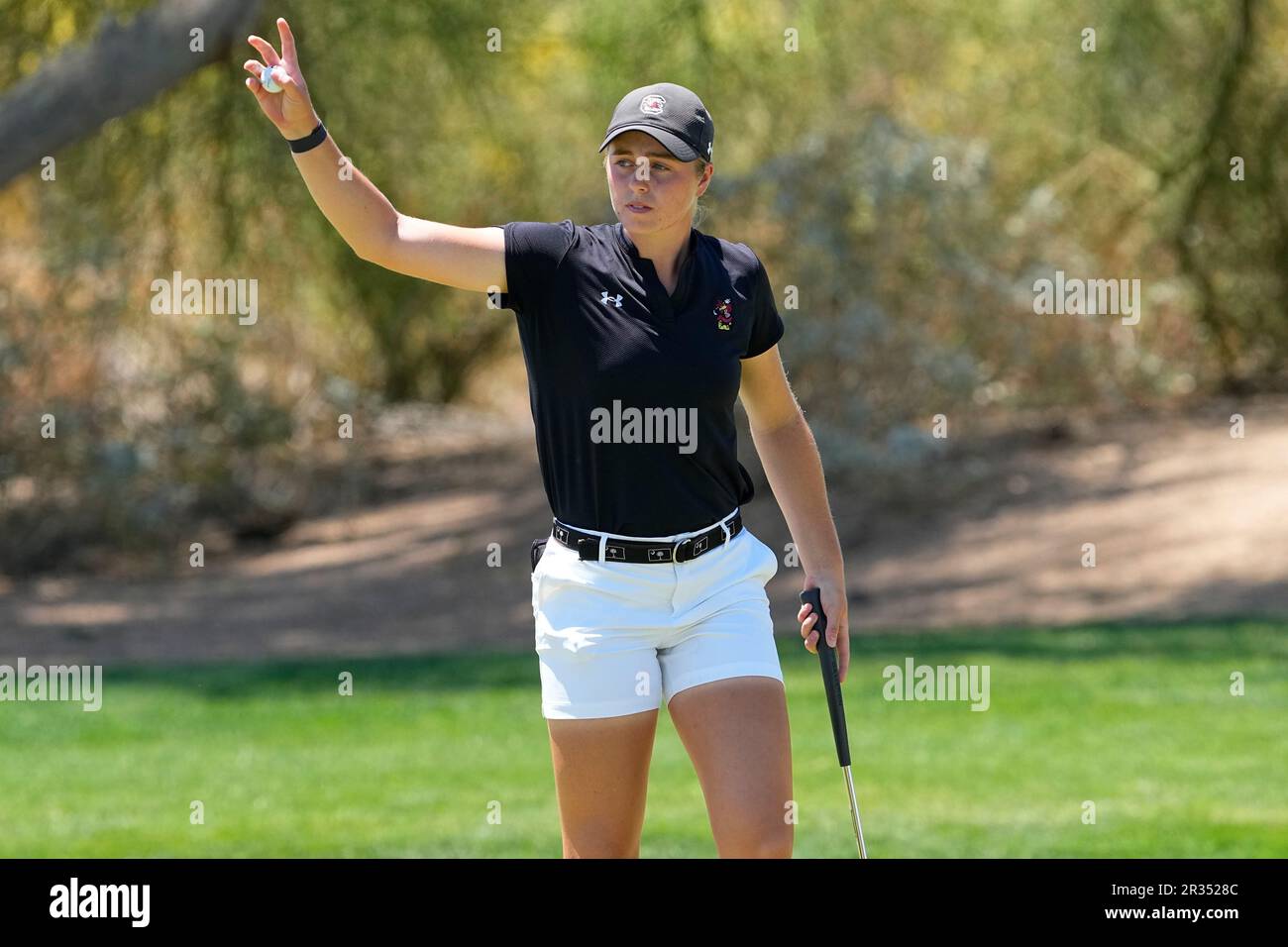 South Carolina golfer Hannah Darling waves after her shot on the first ...