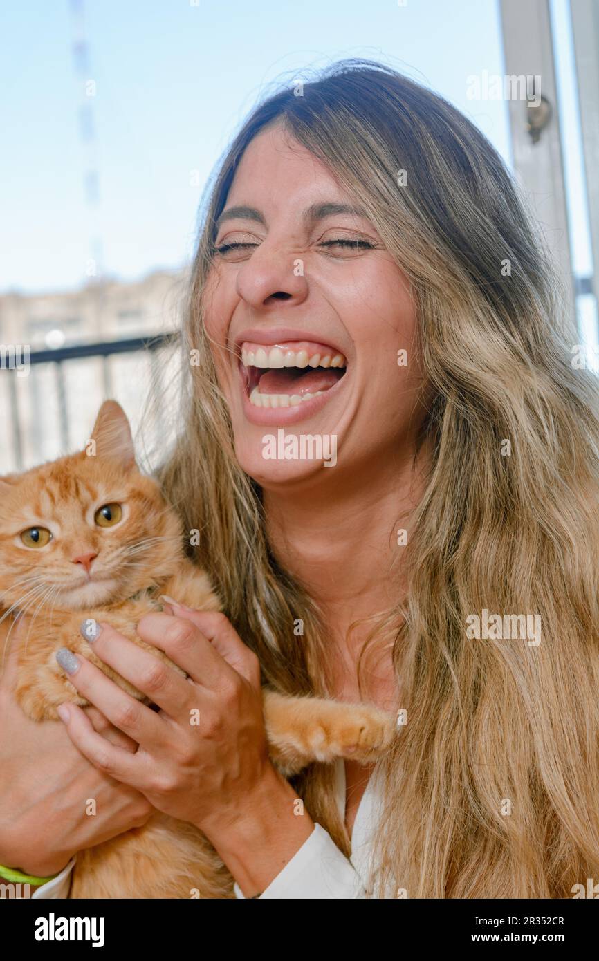 portrait of young latin woman of colombian ethnicity with crazy smile ...