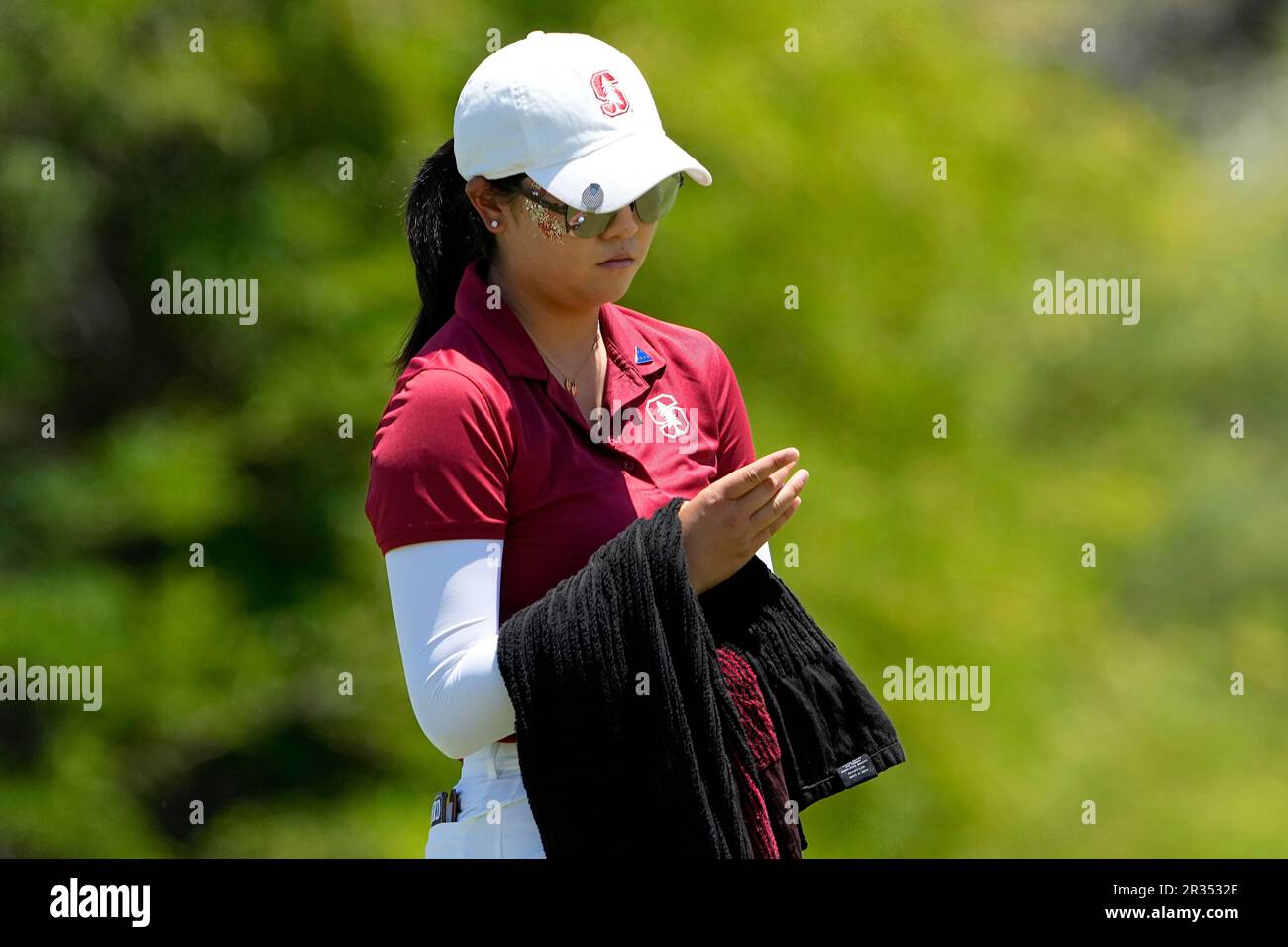 Stanford golfer Rose Zhang inspects her golf ball on the second green ...