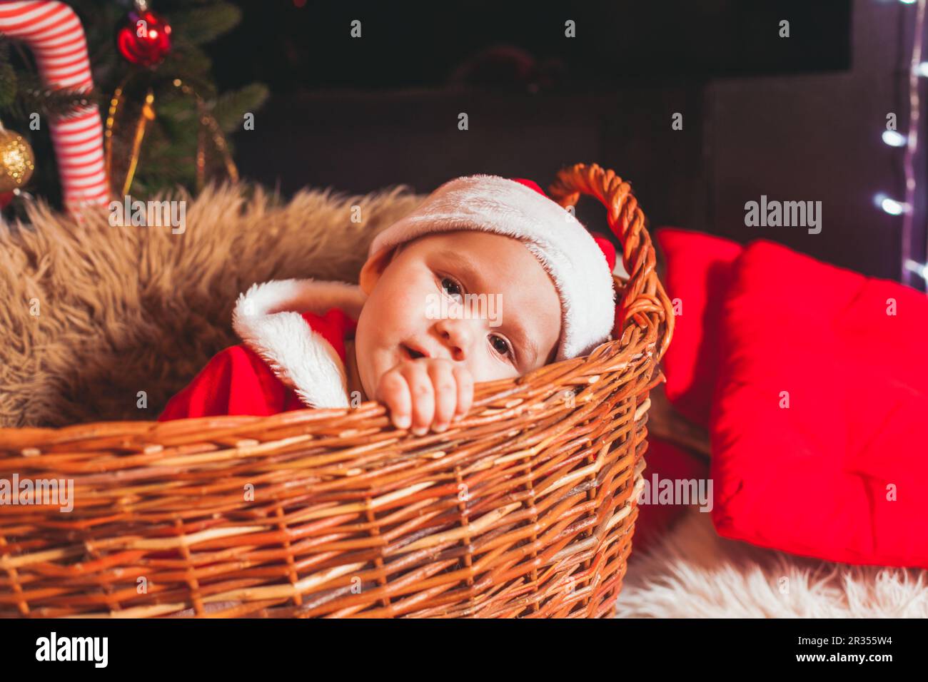 Baby in Santa costume Stock Photo - Alamy