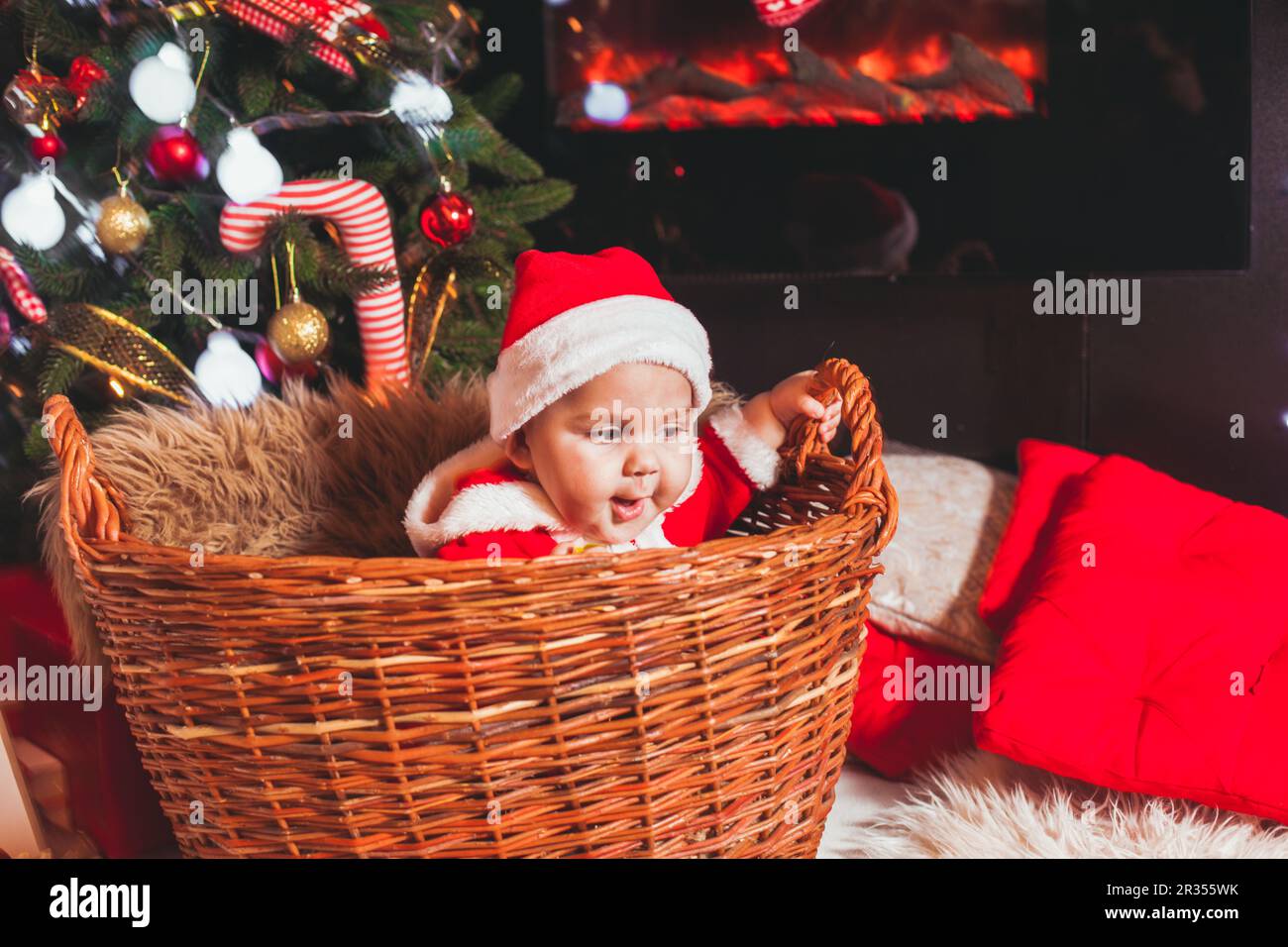 Baby in Santa costume Stock Photo - Alamy